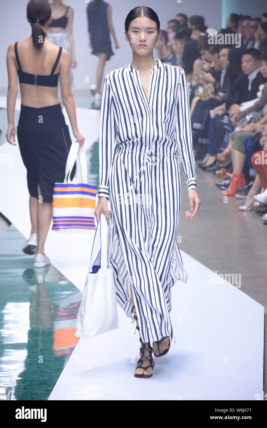 A model displays a new creation at the fashion show for the Spring ...