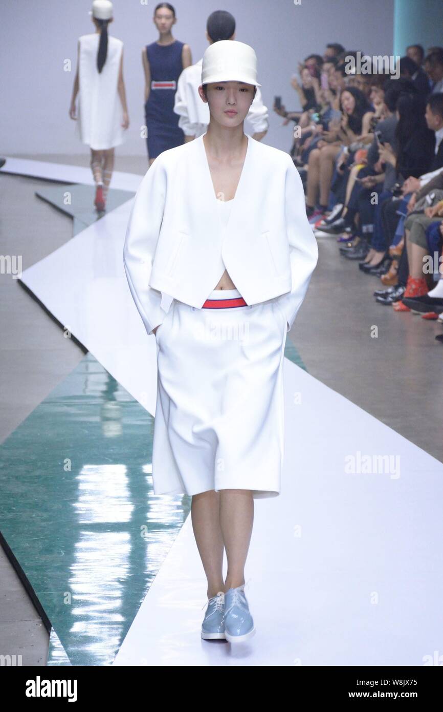 A model displays a new creation at the fashion show for the Spring ...