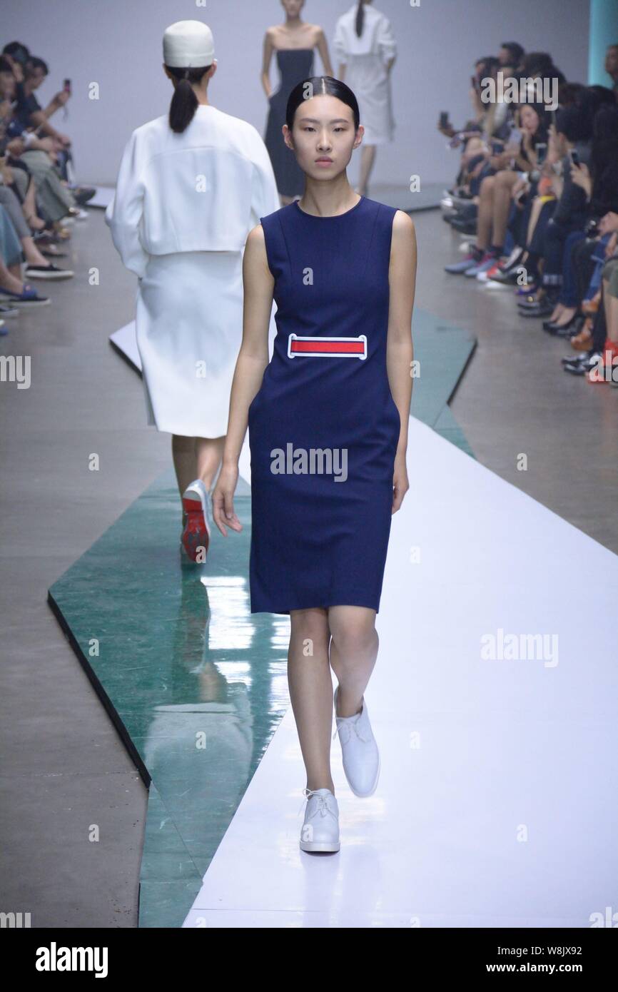 A model displays a new creation at the fashion show for the Spring ...