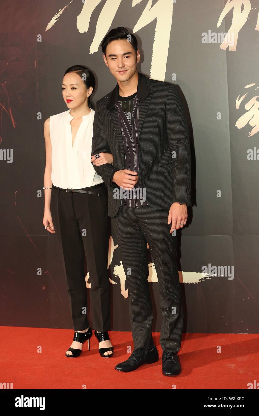 Taiwanese actor Ethan Juan, right, poses at a premiere for his movie ...