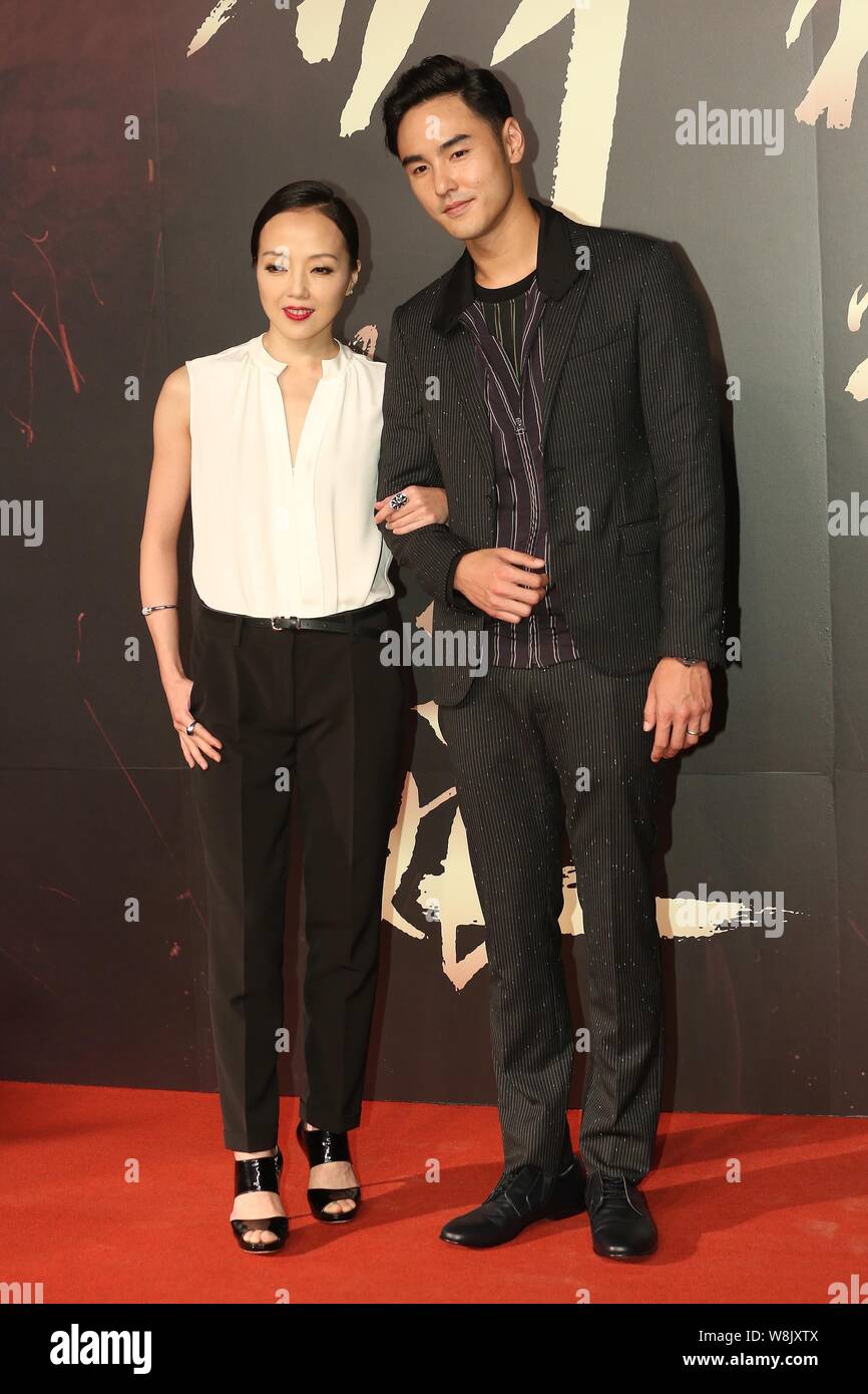Taiwanese actor Ethan Juan, right, poses at a premiere for his movie ...