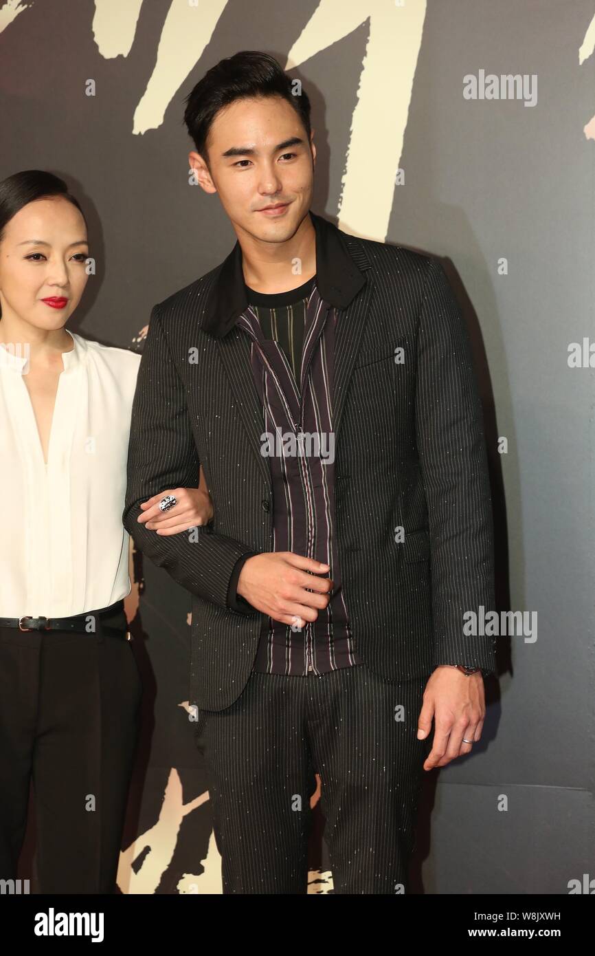 Taiwanese actor Ethan Juan, right, poses at a premiere for his movie ...