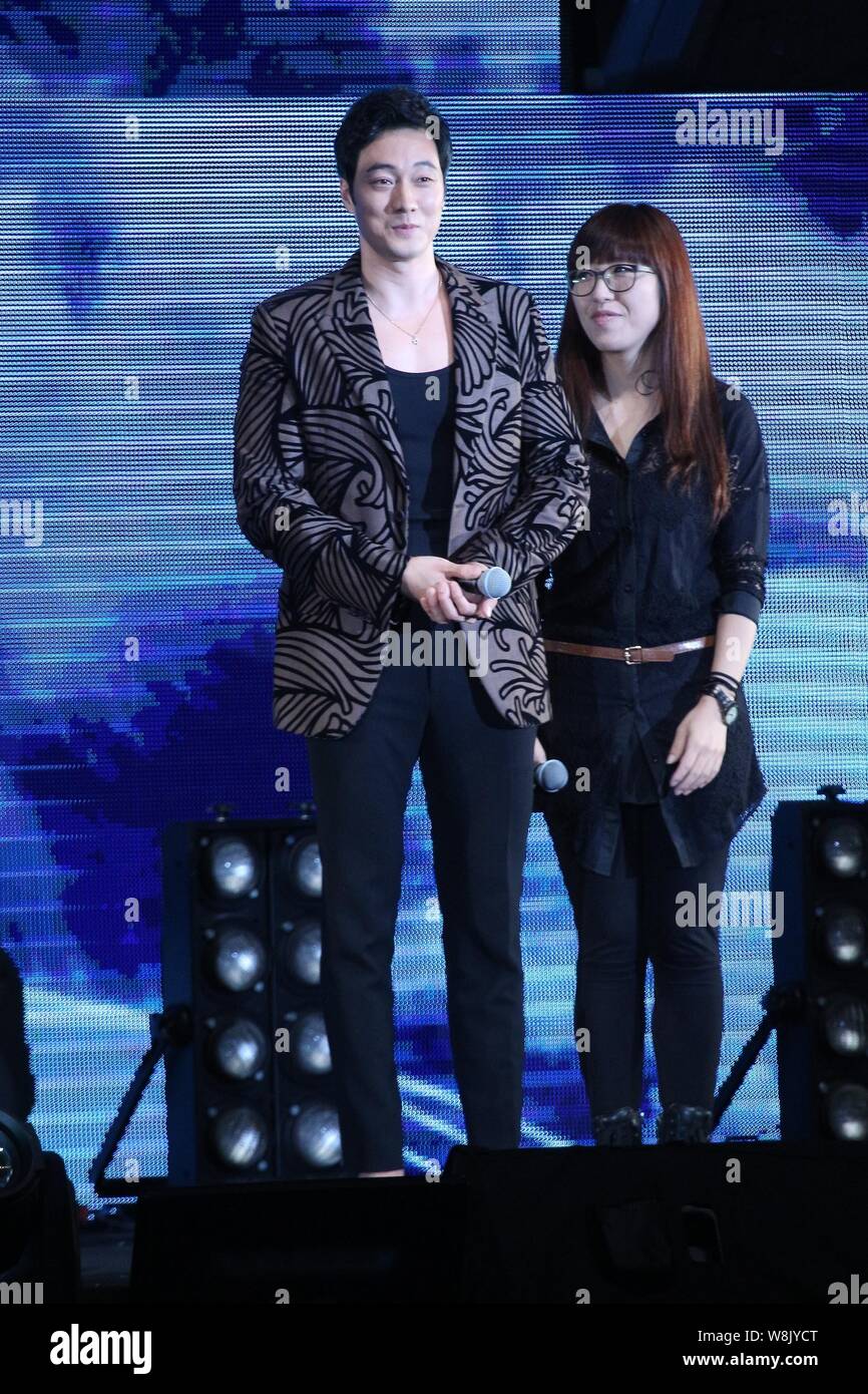 South Korean actor So Ji-Sub, left, smiles at a fan meeting in Taipei ...