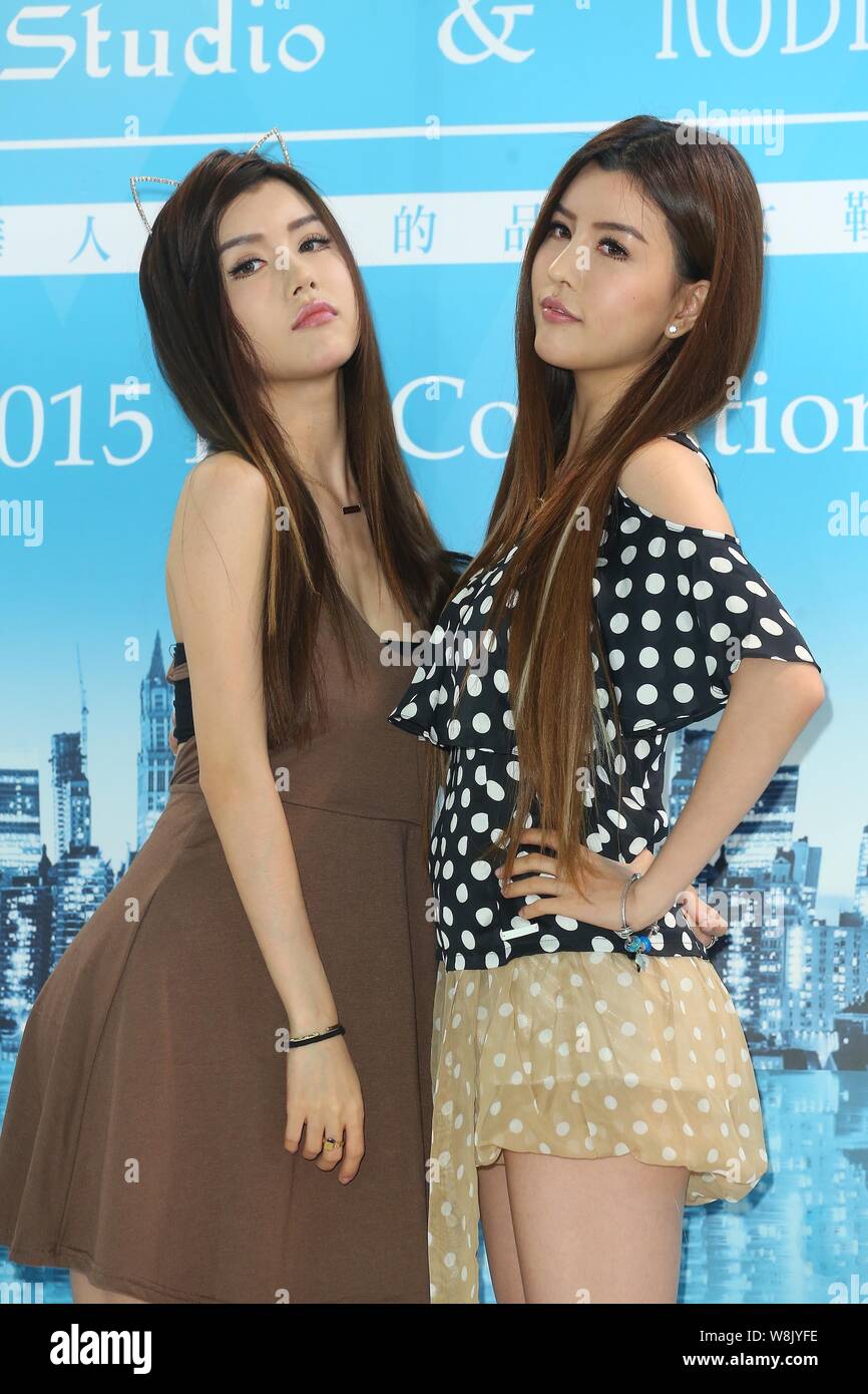 Twin sisters Miko and Yumi of Singaporean girl group By2 pose at a press conference for the ...