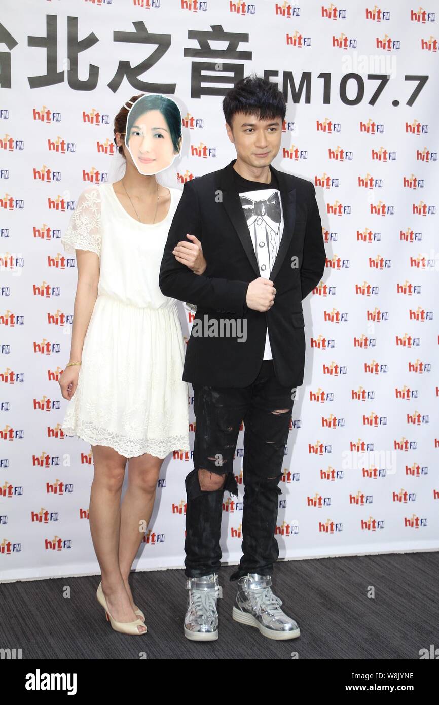 Hong Kong singer Leo Ku, right, poses at a promotional event for Hito ...