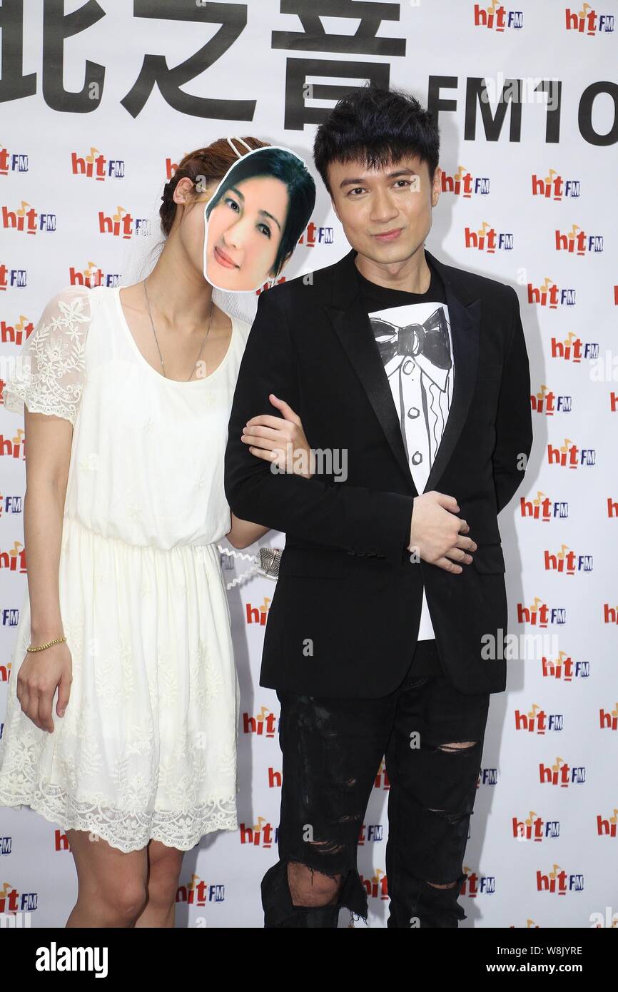 Hong Kong singer Leo Ku, right, poses at a promotional event for Hito ...