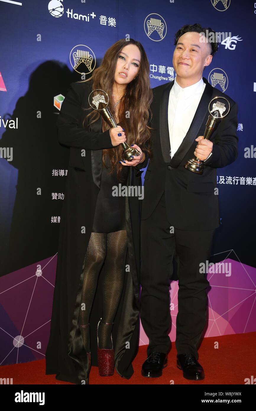 Taiwanese singer A Mei, left, and Hong Kong singer Eason Chan hold ...