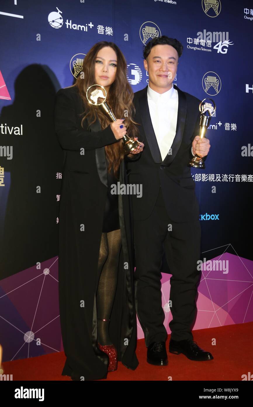 Taiwanese singer A Mei, left, and Hong Kong singer Eason Chan hold ...