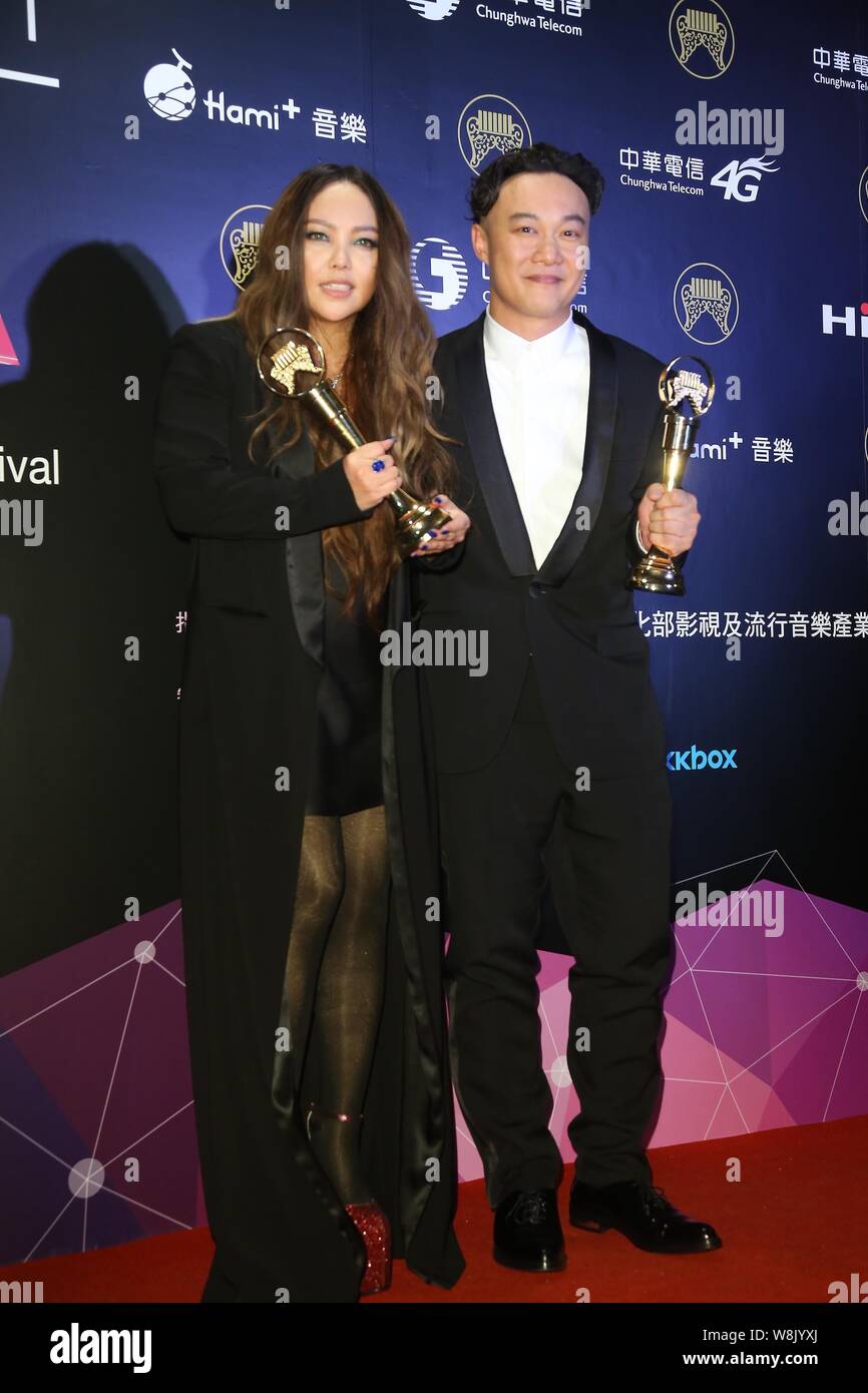 Taiwanese singer A Mei, left, and Hong Kong singer Eason Chan hold ...