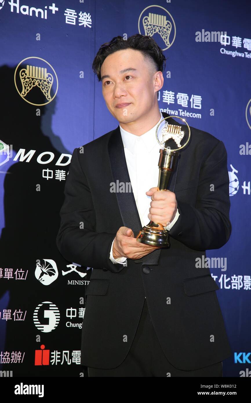 Hong Kong singer Eason Chan holds his trophy for Best Mandarin Male ...