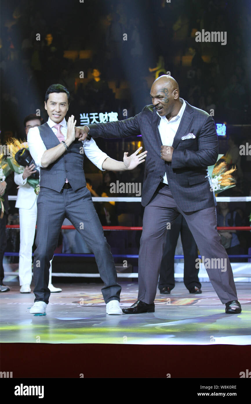 Hong Kong actor Donnie Yen, left, interacts with retired American boxer ...