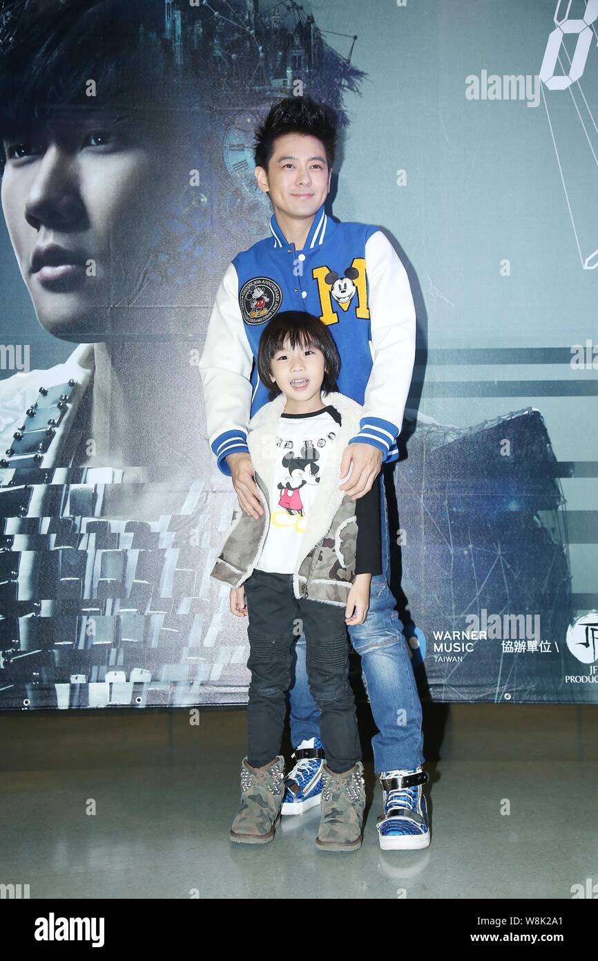 Taiwanese singer, actor and racer Jimmy Lin, back, and his son Kimi ...
