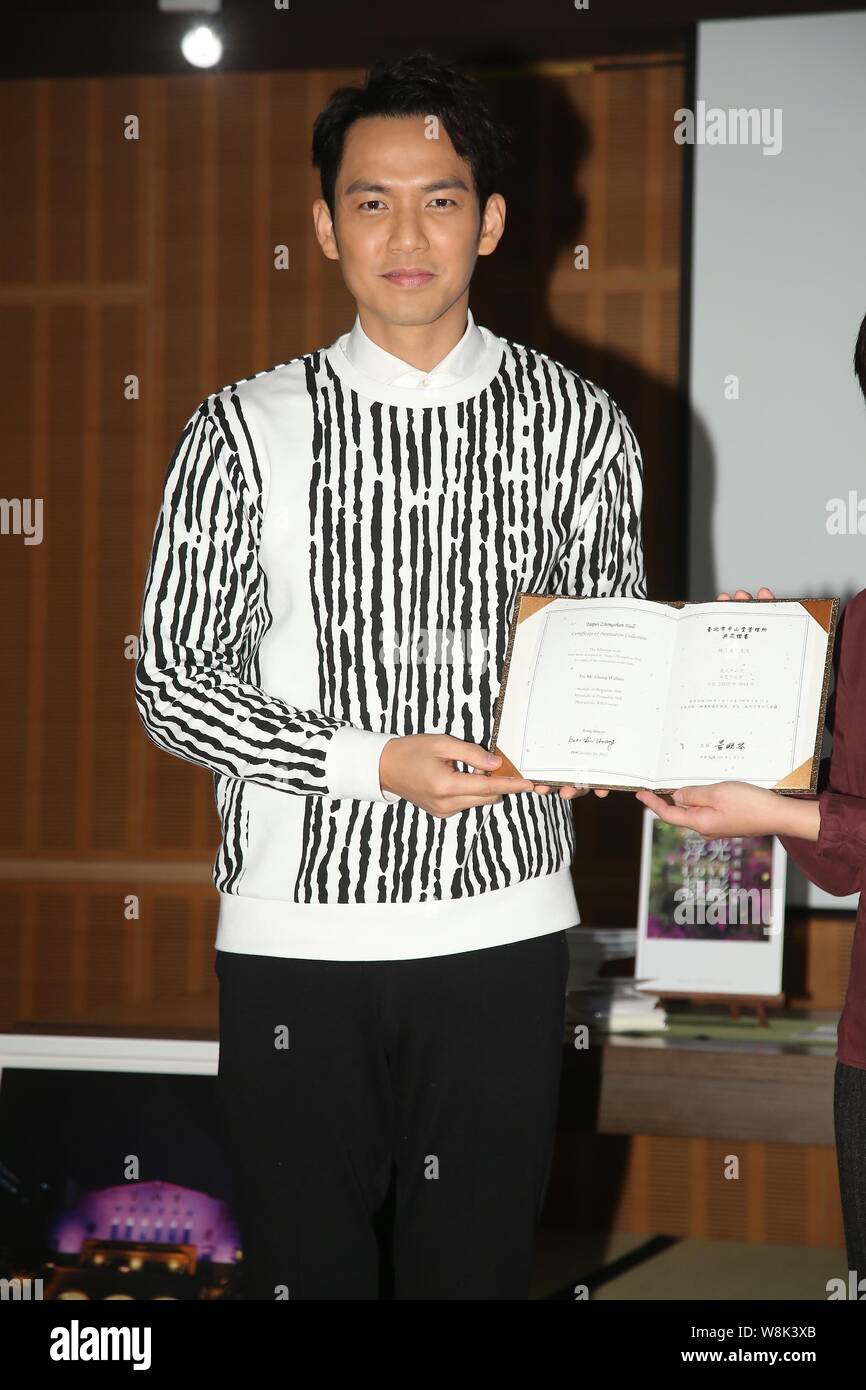 Hong Kong actor Wallace Chung poses during his photo exhibition in ...