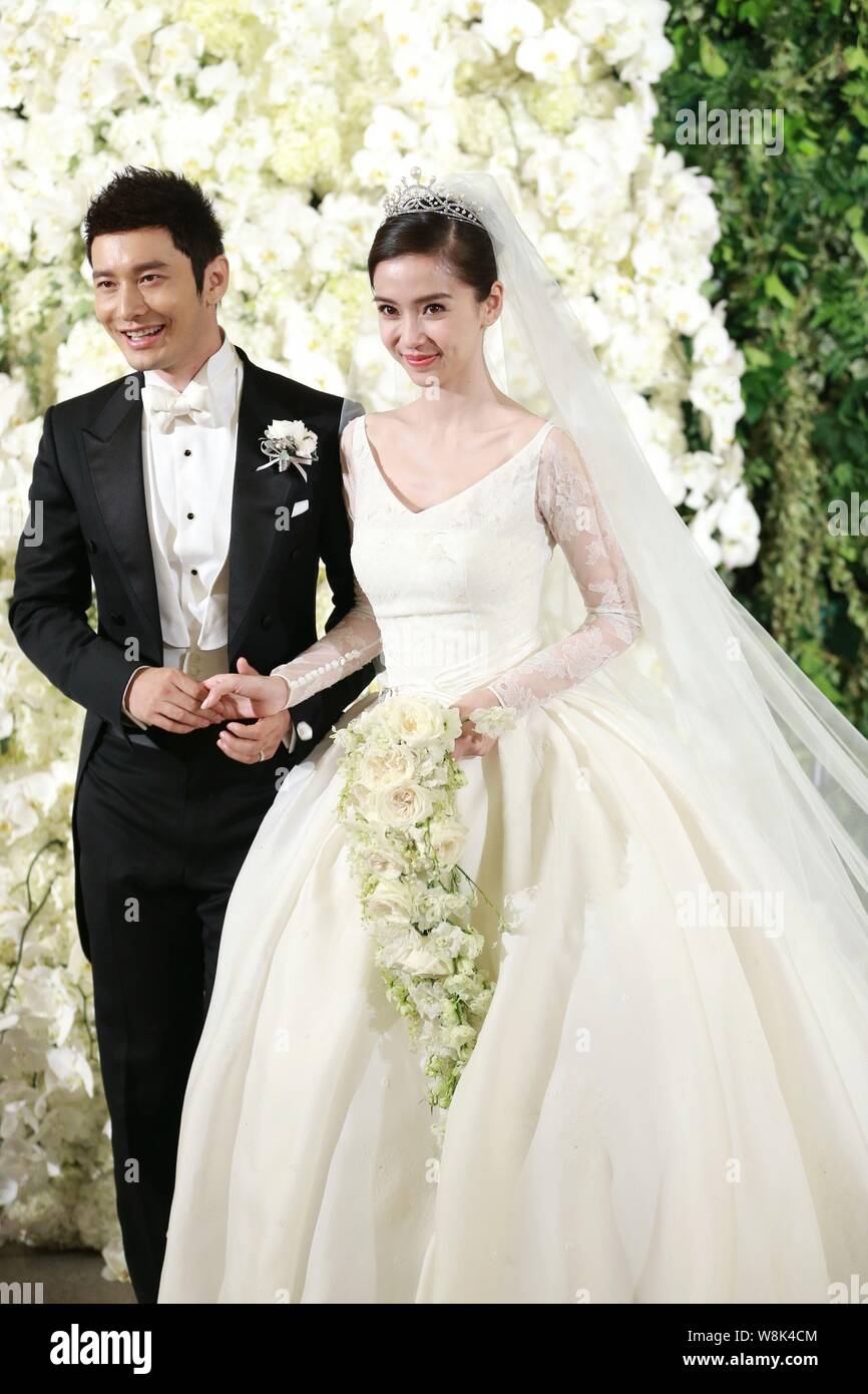 Chinese actor Huang Xiaoming, left, and his actress wife Angelababy ...