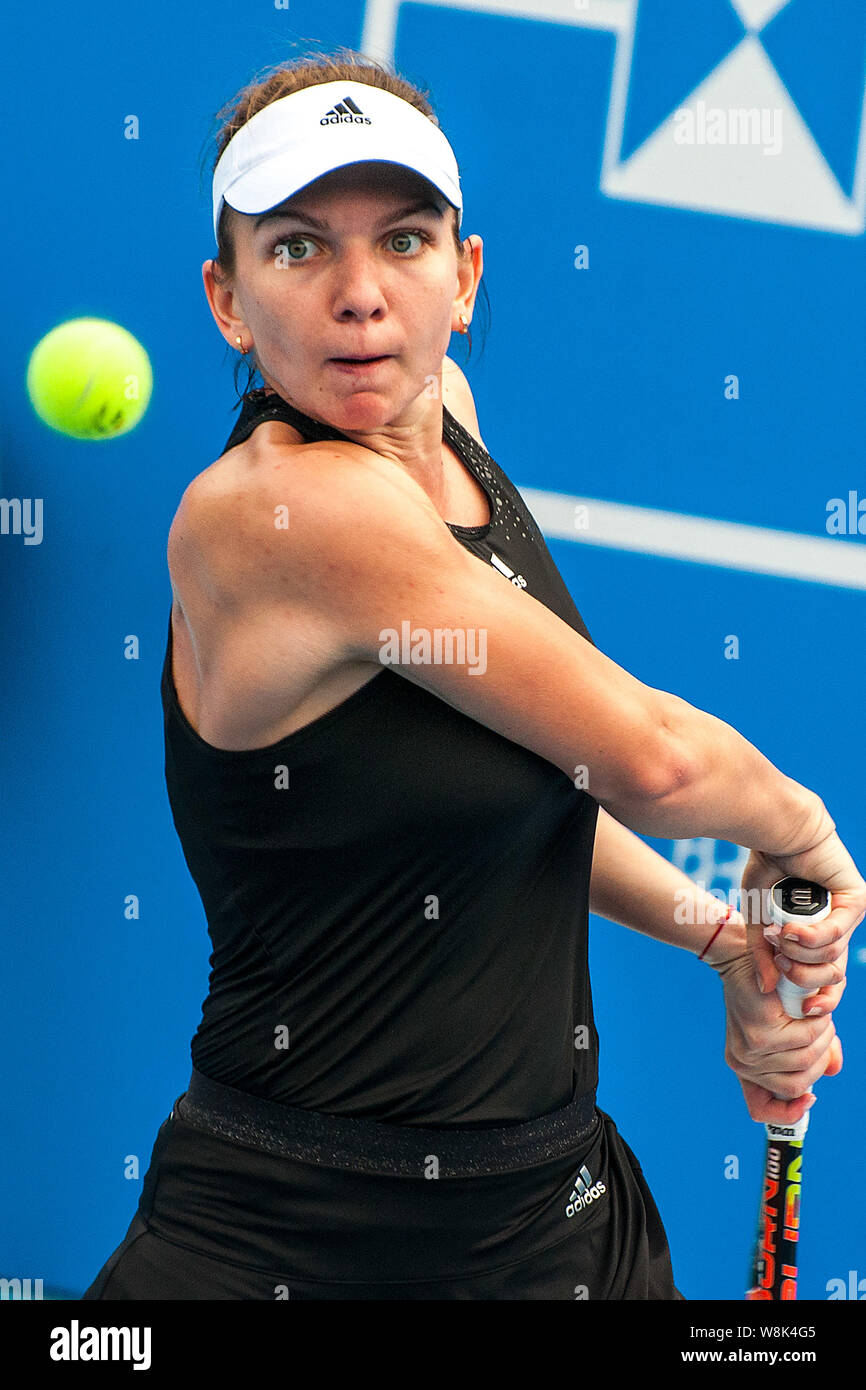Simona Halep of Romania prepares to return a shot to Annika Beck of ...