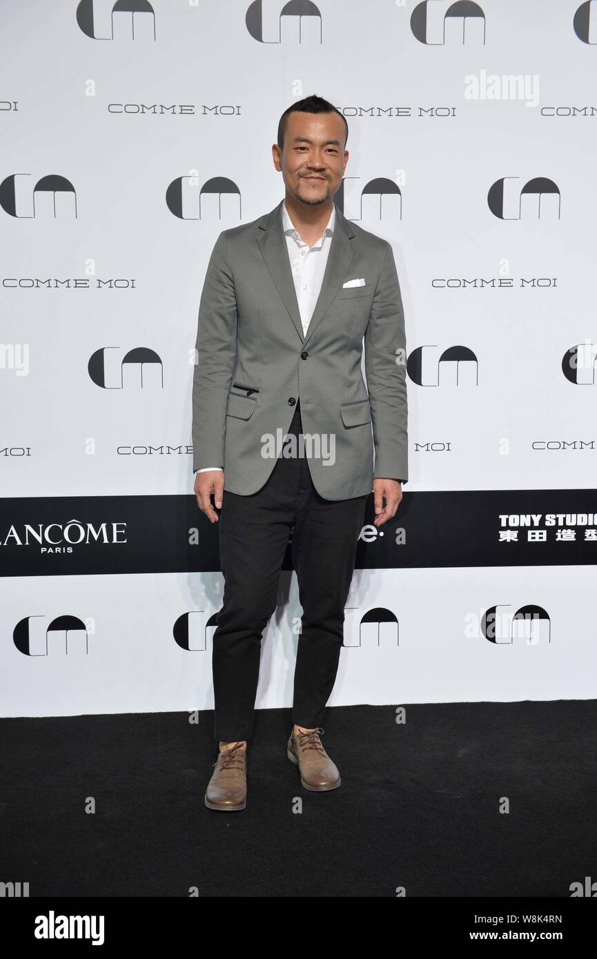 Chinese actor Liao Fan poses during the Comme Moi fashion show by ...