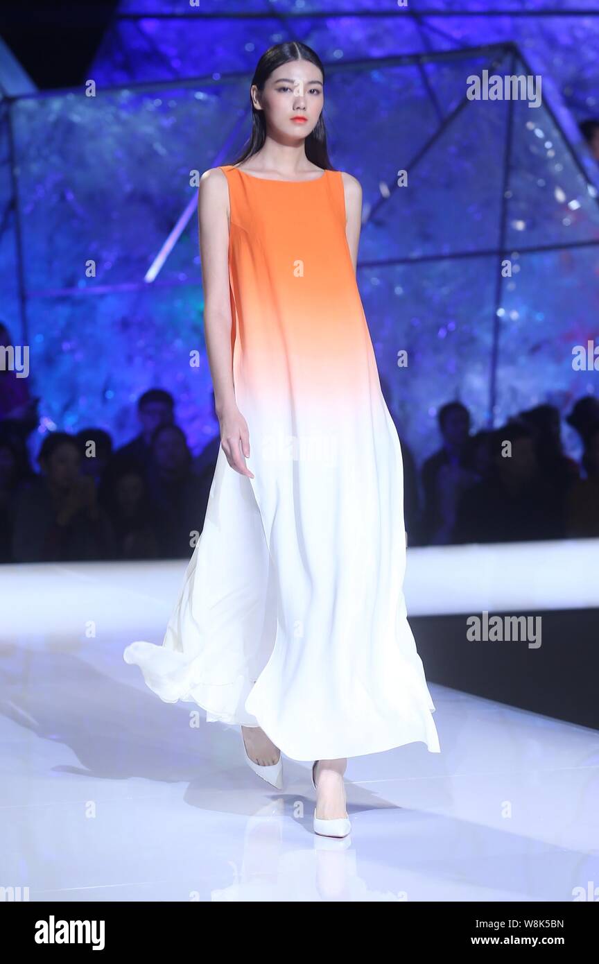 A model displays a new creation at the Heaven Gaia Xiong Ying High ...