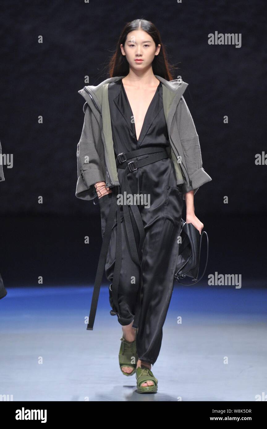 A model displays a new creation at the Harrison Wong fashion show of ...