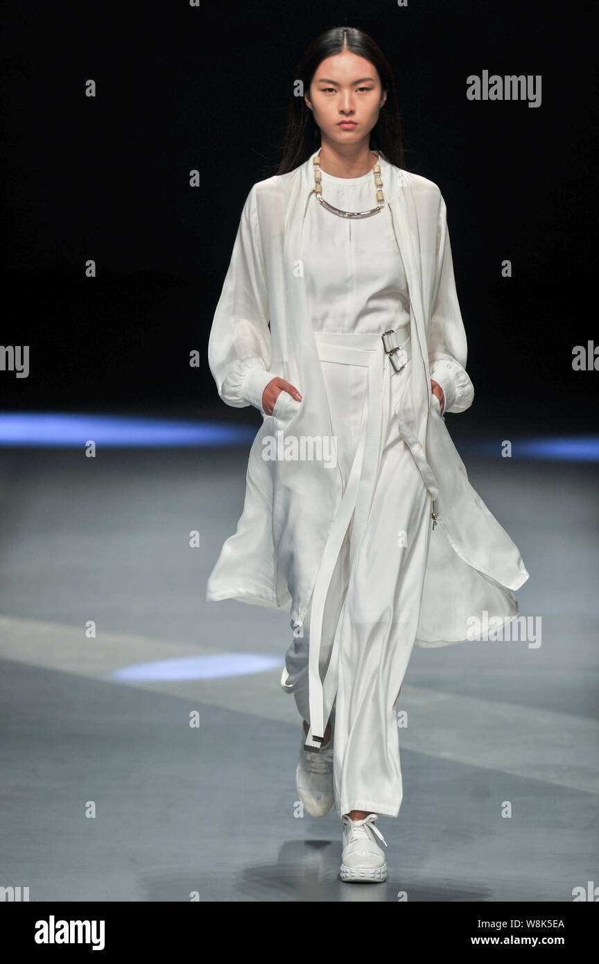 A model displays a new creation at the Harrison Wong fashion show of ...