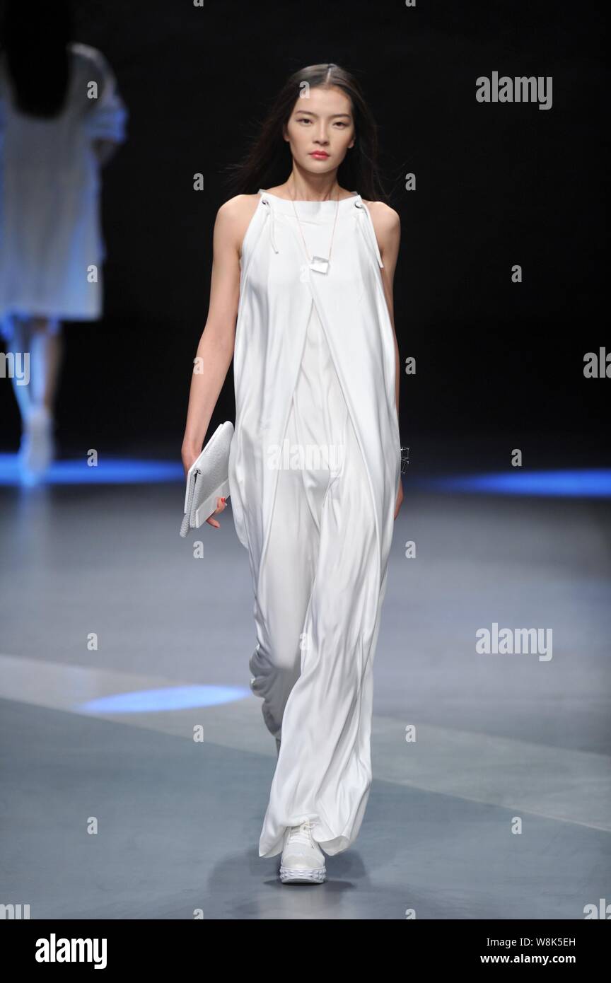 A model displays a new creation at the Harrison Wong fashion show of ...