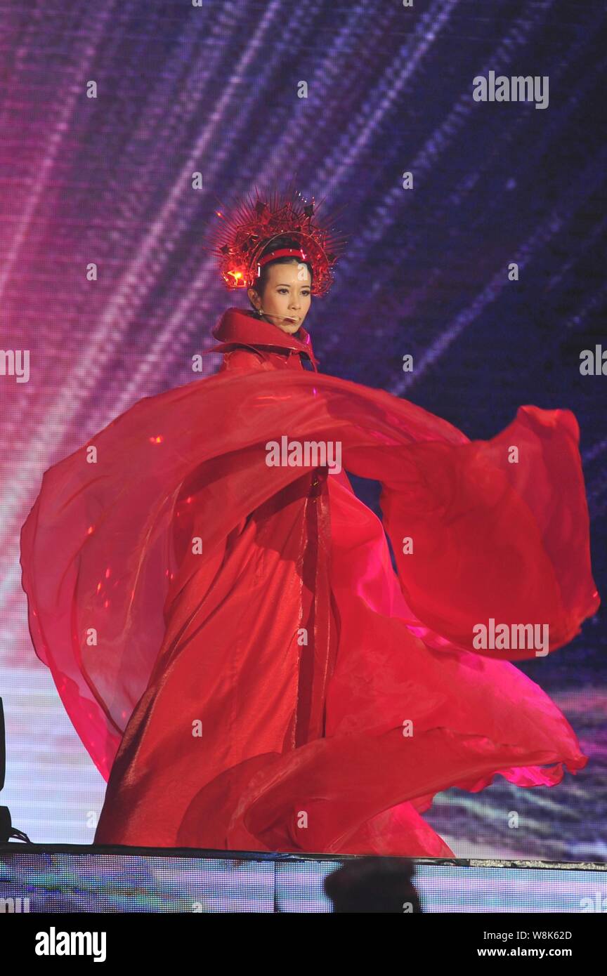 Hong Kong singer Karen Mok performs during her concert in Beijing ...