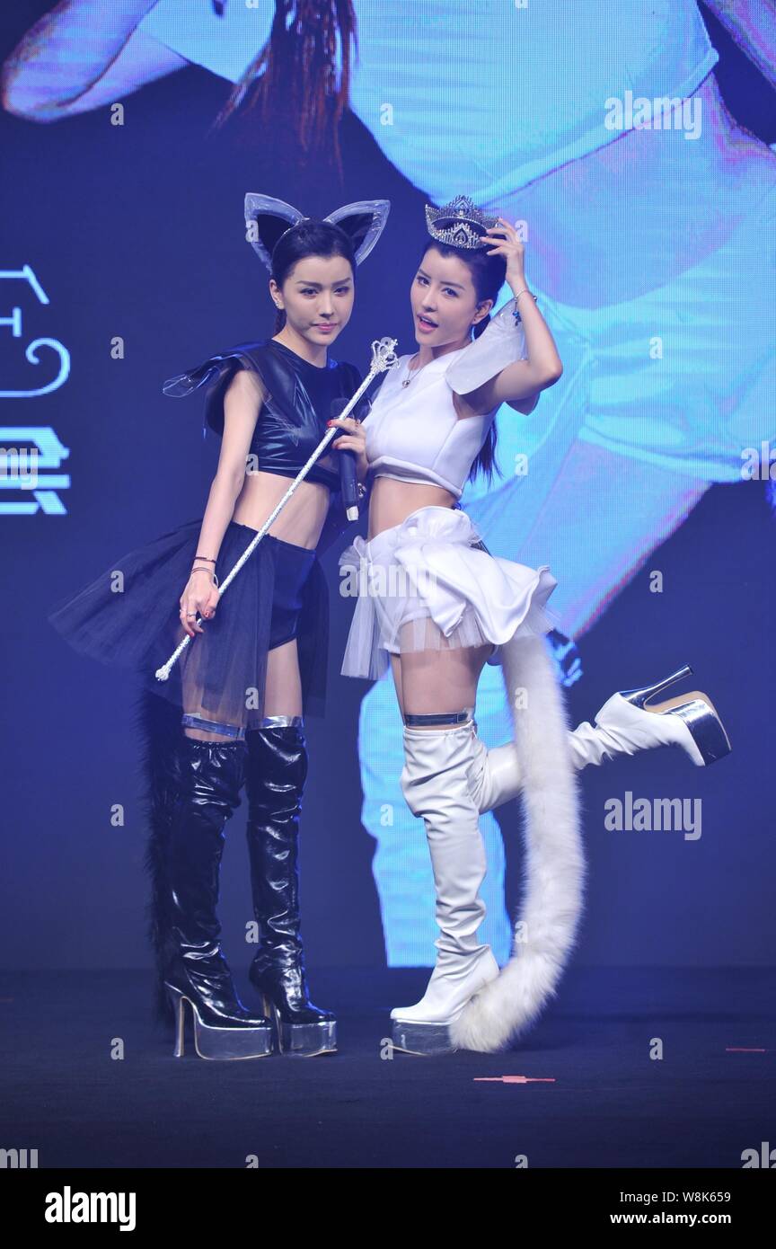 The twin sisters Miko and Yumi of Singaporean girl group BY2 pose at a ...