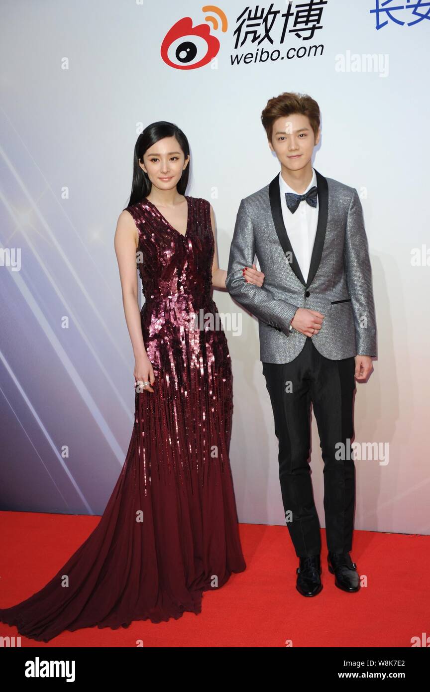 Chinese actress Yang Mi, left, and singer Lu Han pose on the red carpet ...