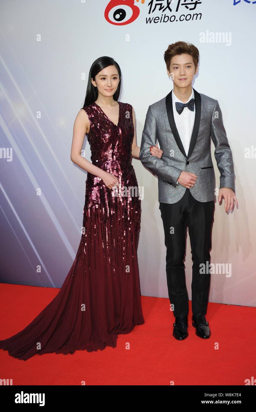 Chinese actress Yang Mi, left, and singer Lu Han pose on the red carpet ...