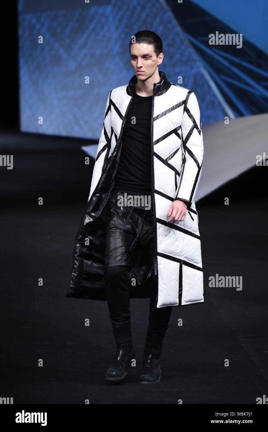 A model displays a new creation designed by Liu Shixi at the Natsuko fashion show during the ...