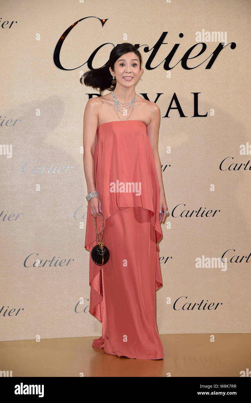 Hong Kong singer and actress Charlie Yeung poses as she arrives for a ...