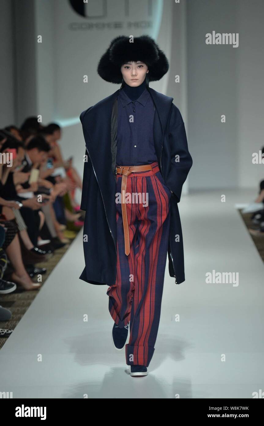 A model displays a new creation designed by Chinese model Lv Yan at ...