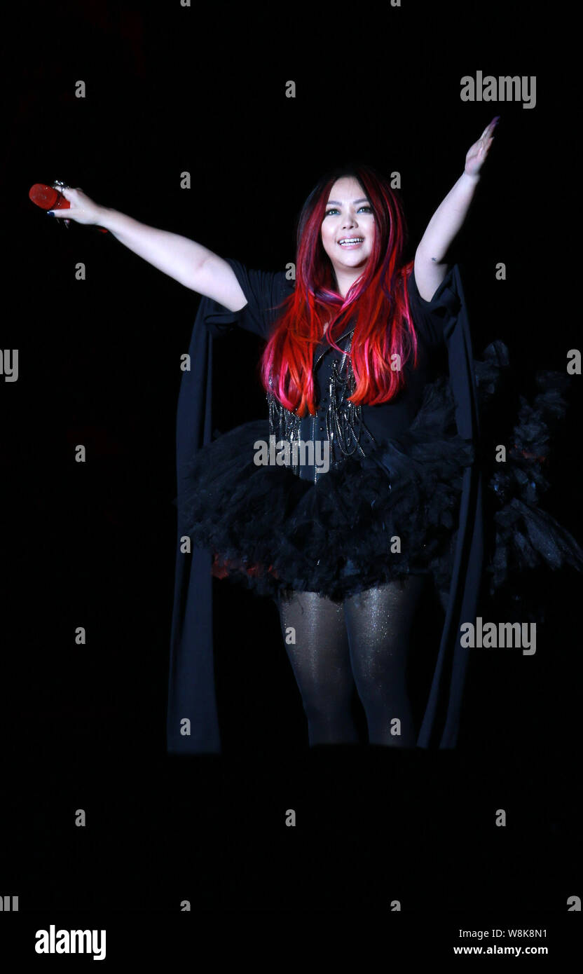 Taiwanese singer A Mei performs during her concert in Beijing, China ...