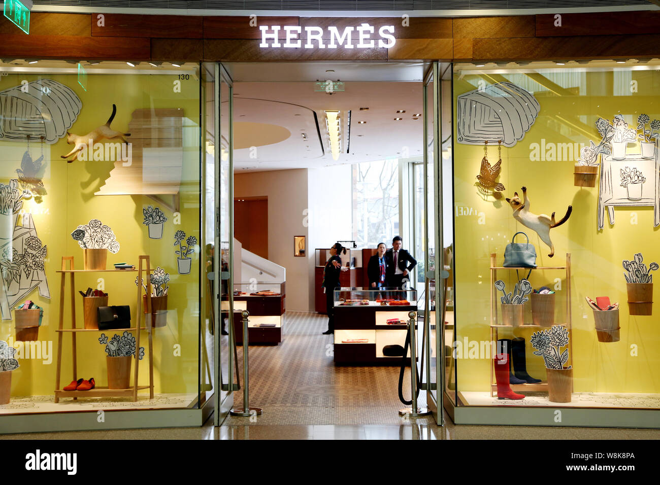 --FILE--Chinese clerks work in the fashion boutique of Hermes at the ...