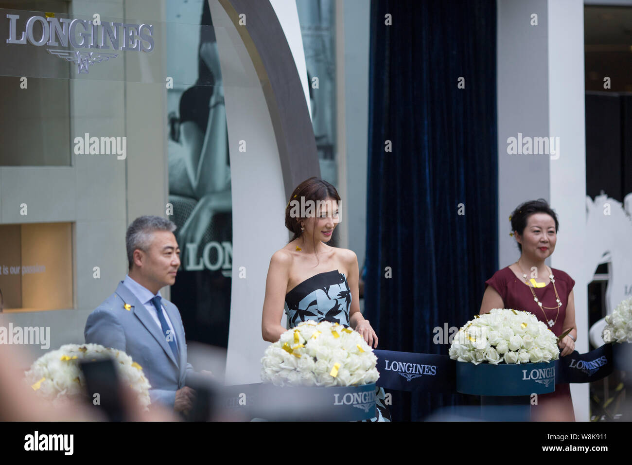 Taiwanese model and actress Lin Chi-ling, center, attends the opening ...