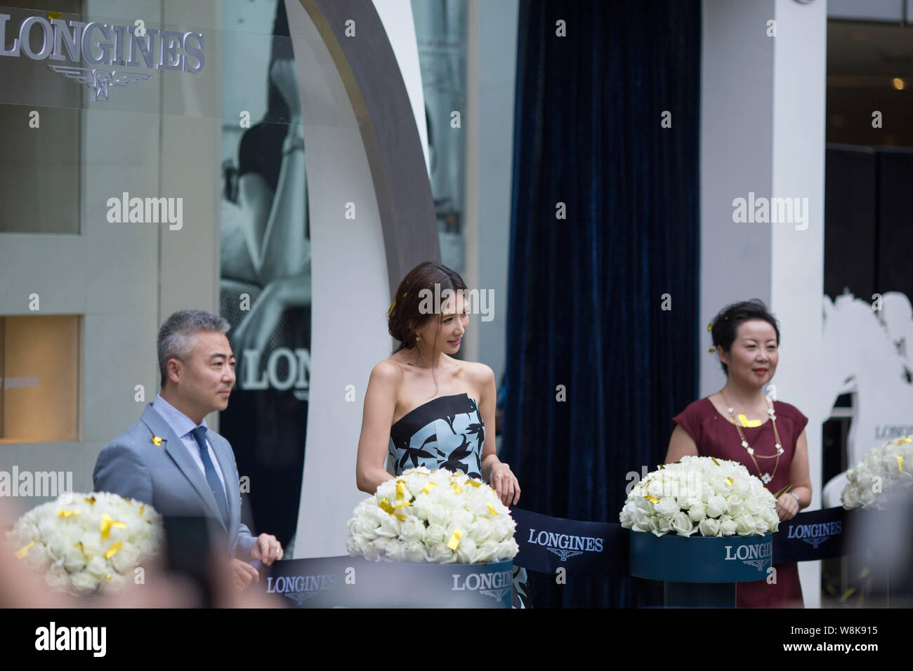 Taiwanese model and actress Lin Chi-ling, center, attends the opening ...