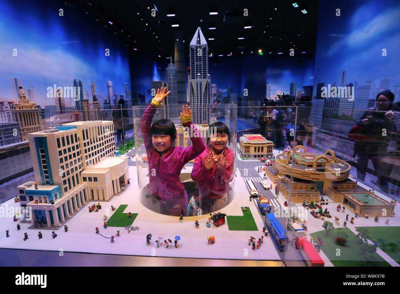 Visitors look at Shanghai's landmark buildings made with Lego bricks at ...