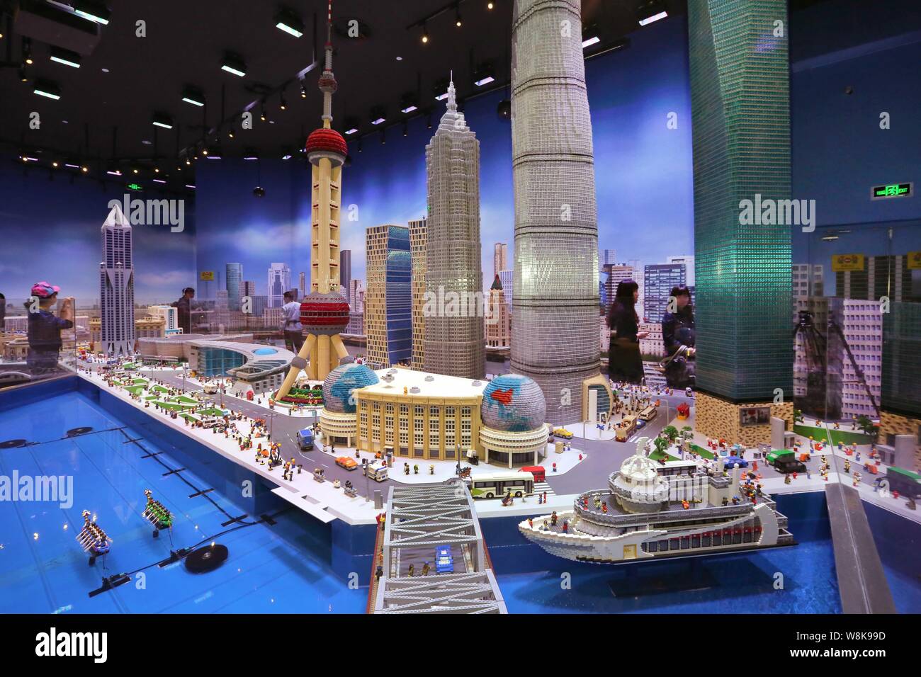 Visitors look at Shanghai's landmark buildings made with Lego bricks at ...