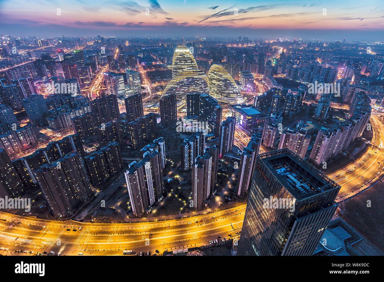 --FILE--A night view of the Wangjing area with the Wangjing SOHO, back ...