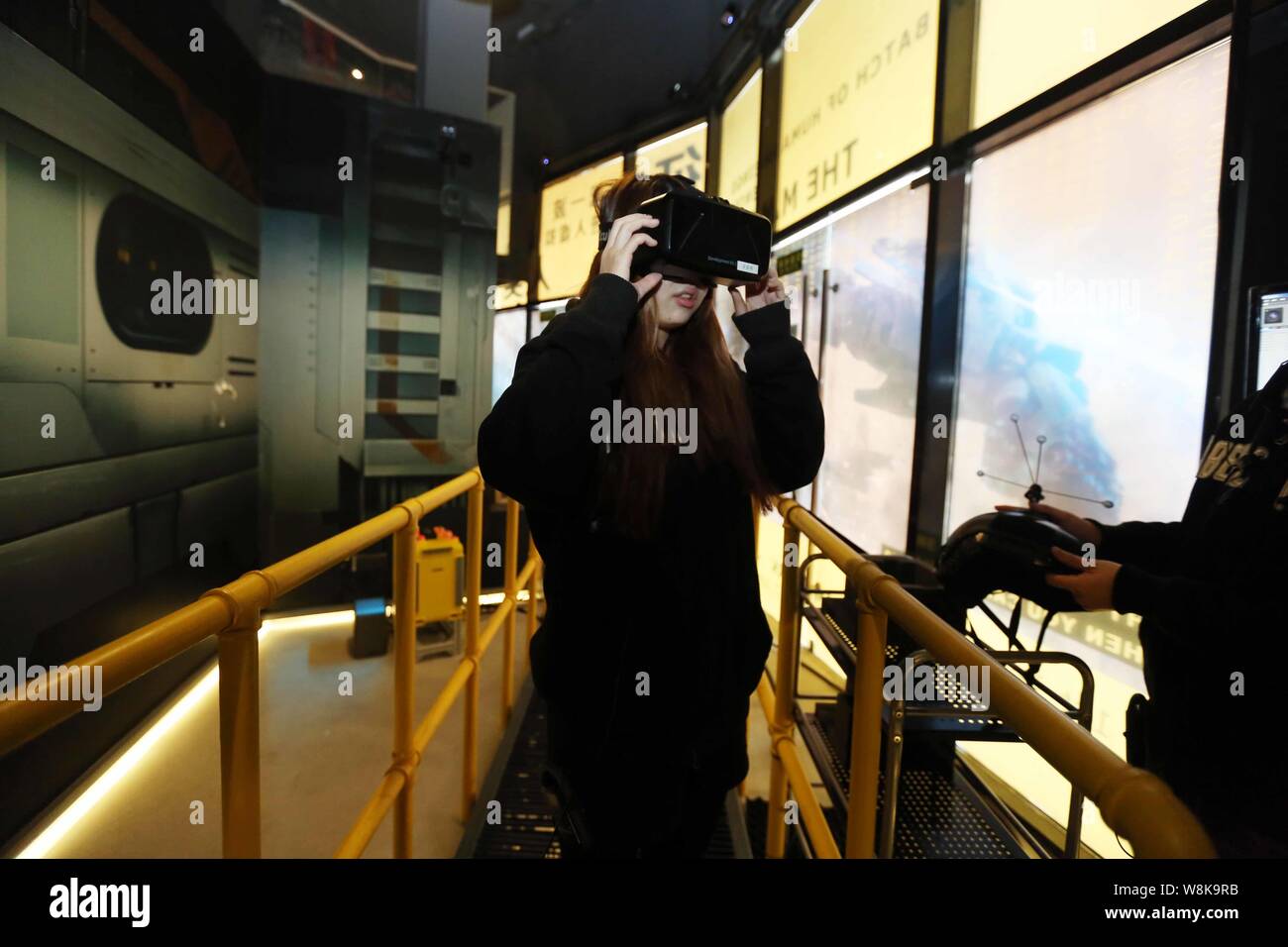 --FILE--A visitors tries out a virtual reality device at a VR park in ...