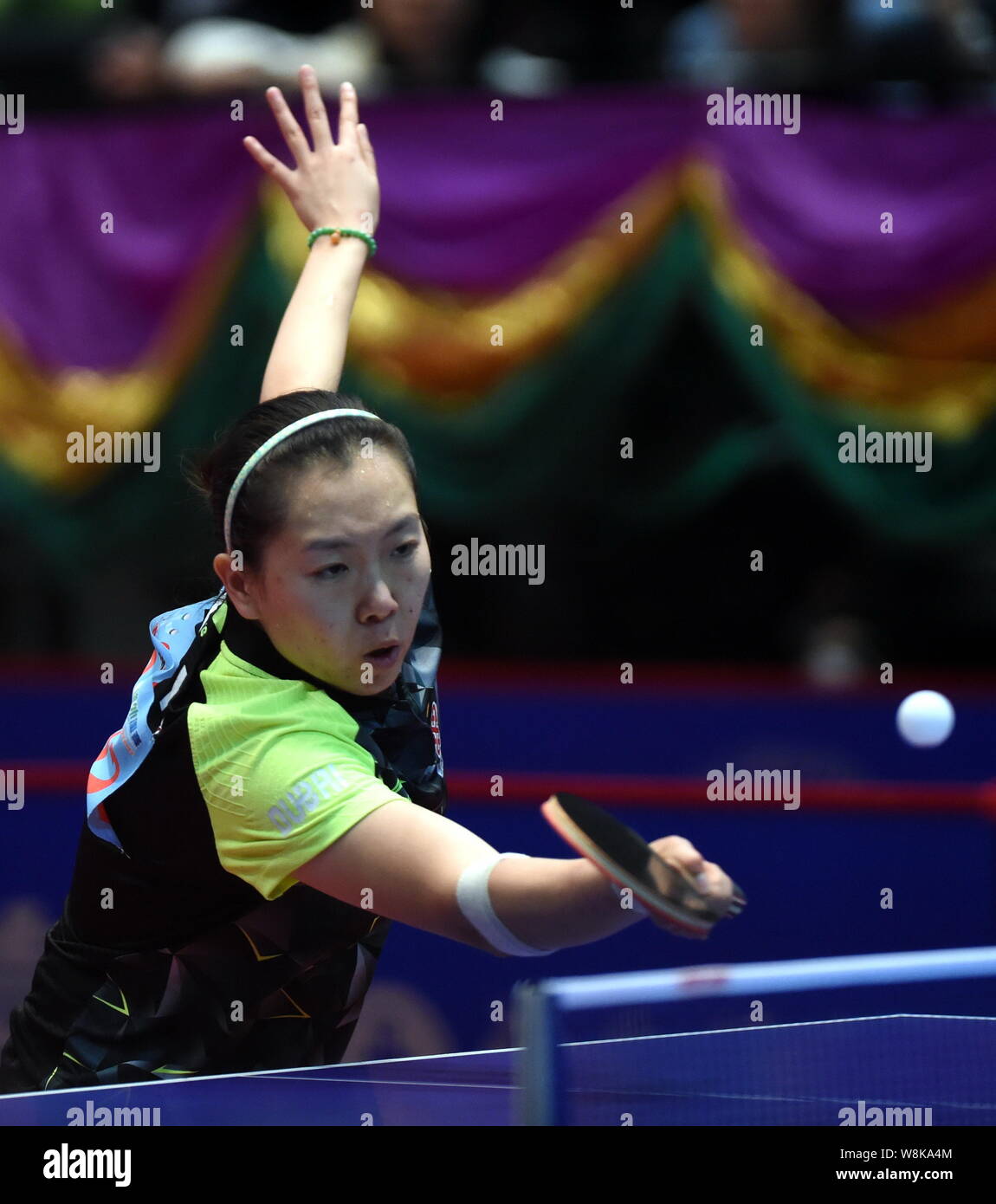 Li Xiaoxia of China serves against Kasumi Ishikawa of Japan in their ...