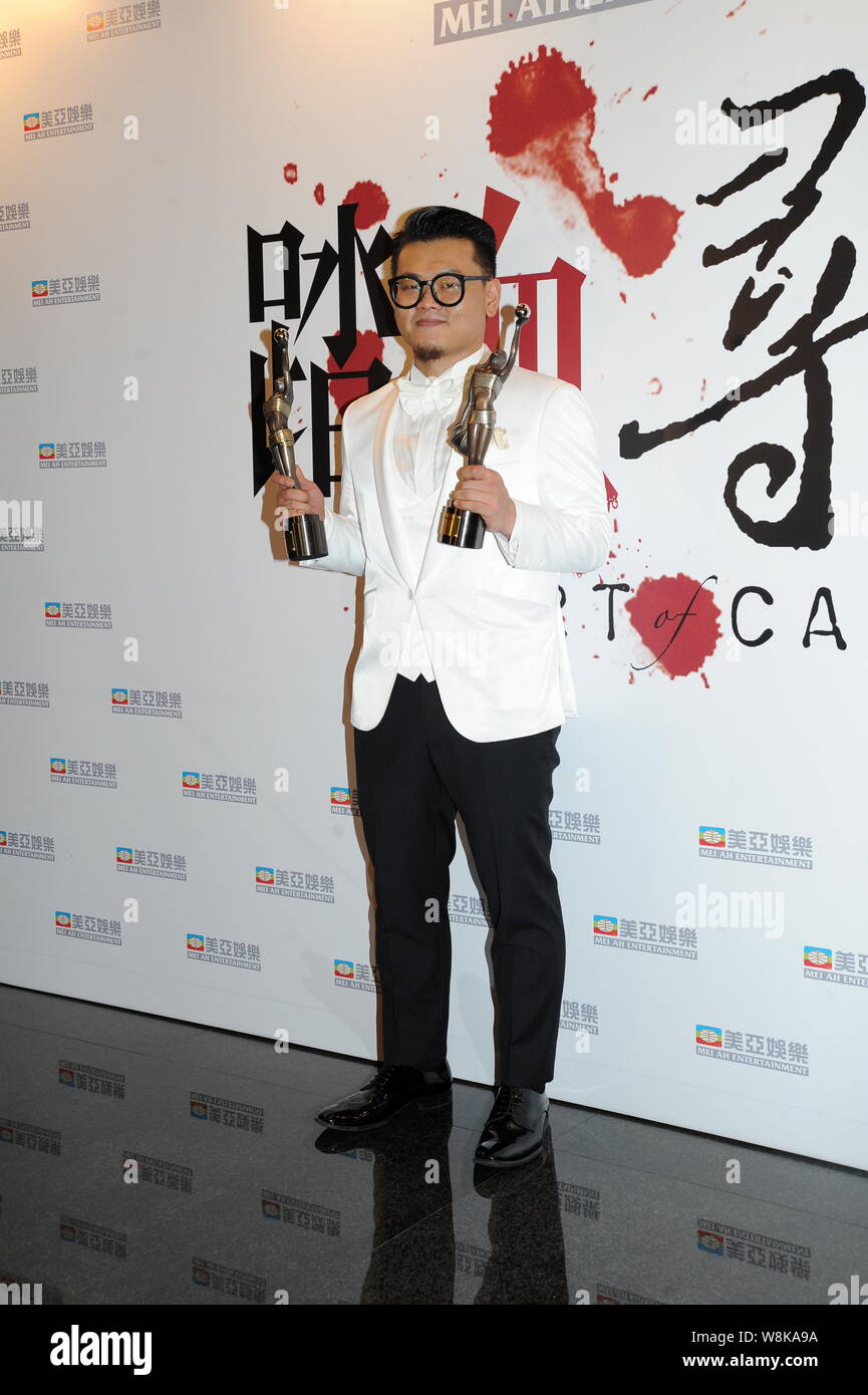 Hong Kong actor Michael Ning poses with his trophies for the Best ...