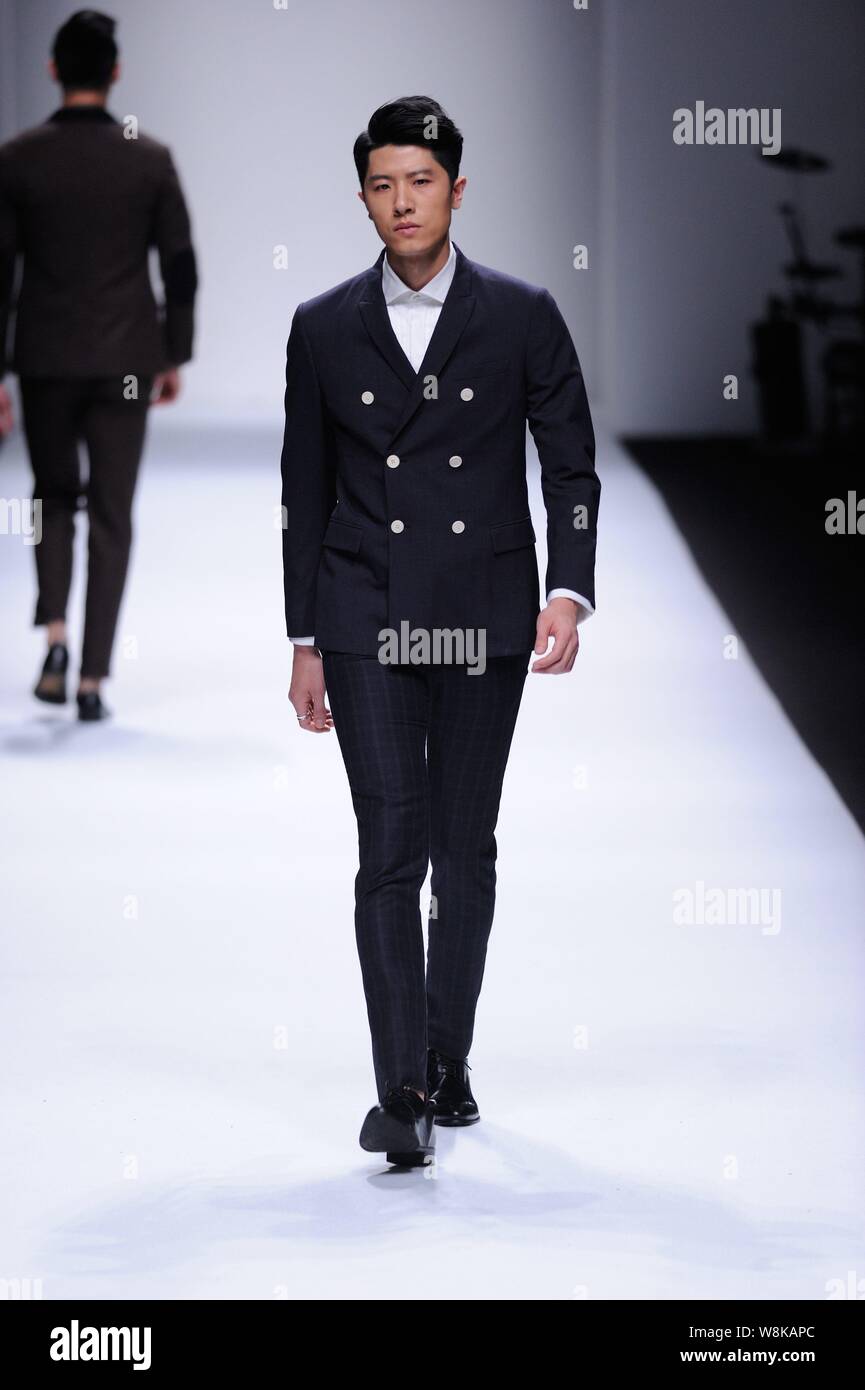 A model displays a new creation at a fashion show of Woolmark Gold X ...