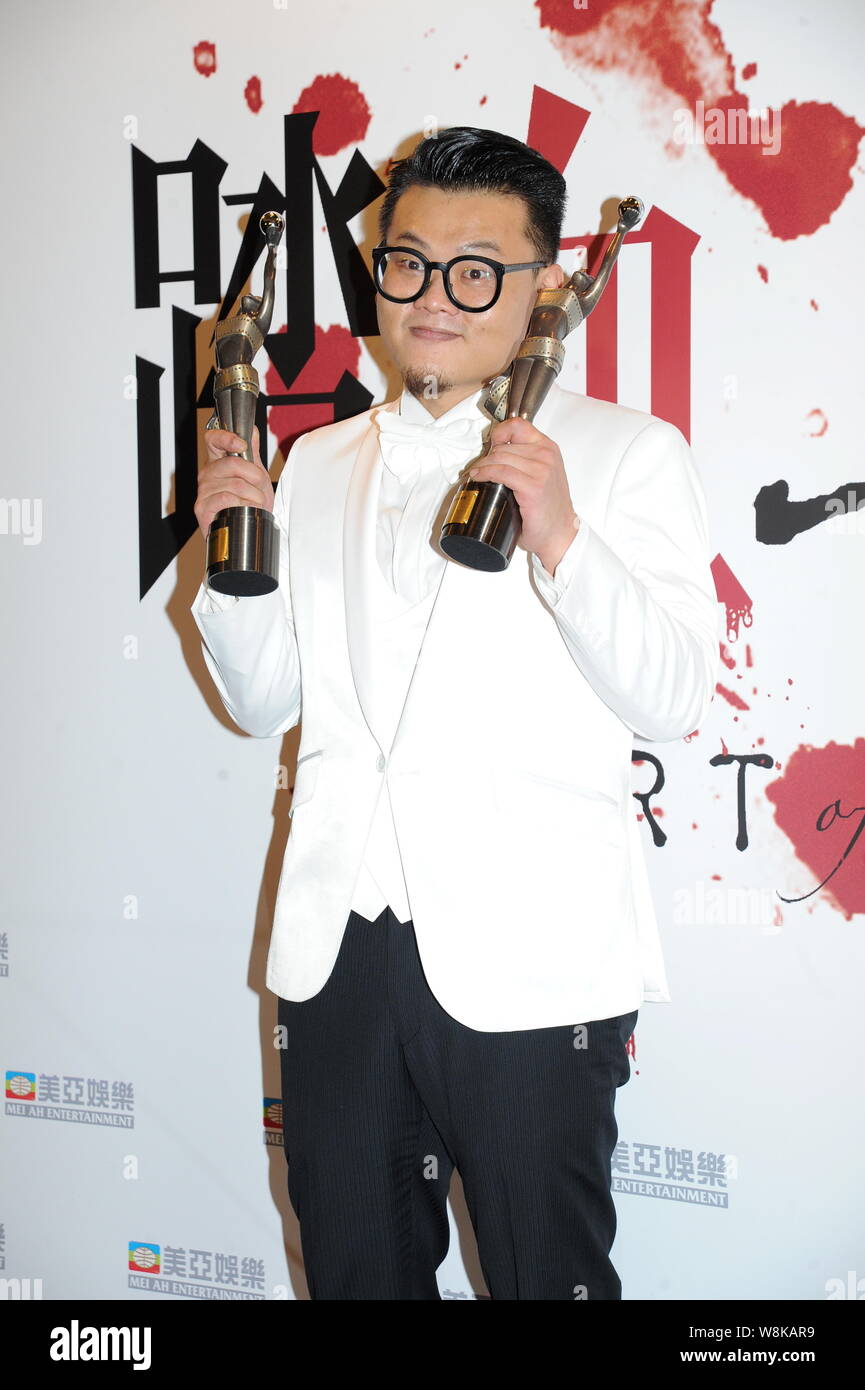 Hong Kong actor Michael Ning poses with his trophies for the Best ...
