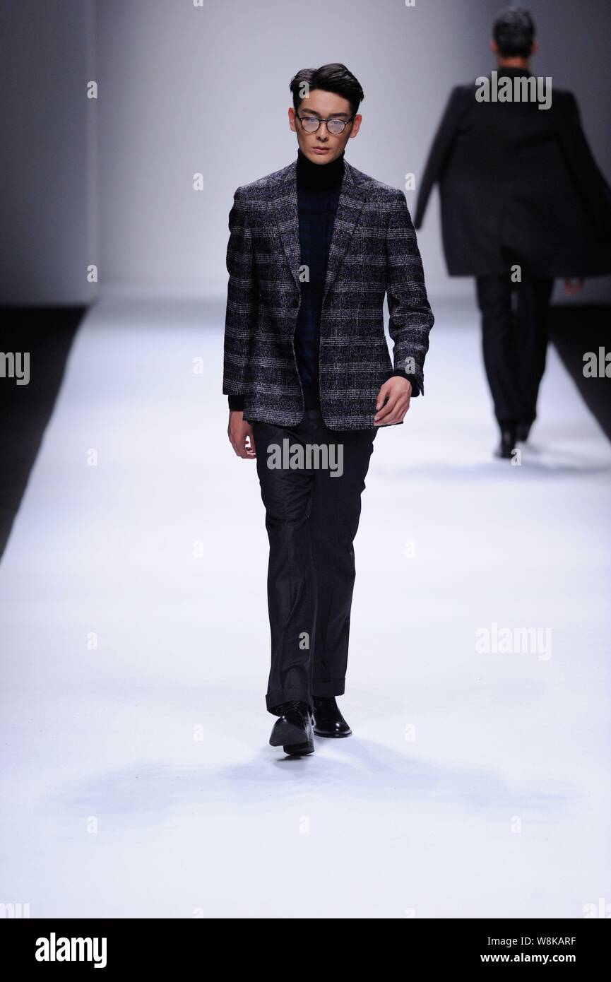 A model displays a new creation at a fashion show of Woolmark Gold X ...