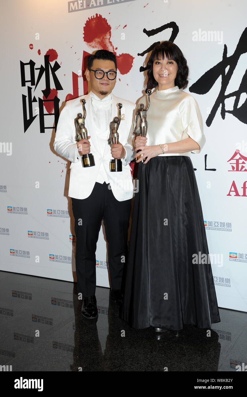 Taiwanese actress Elaine Jin, right, and Hong Kong actor Michael Ning pose with their trophies ...