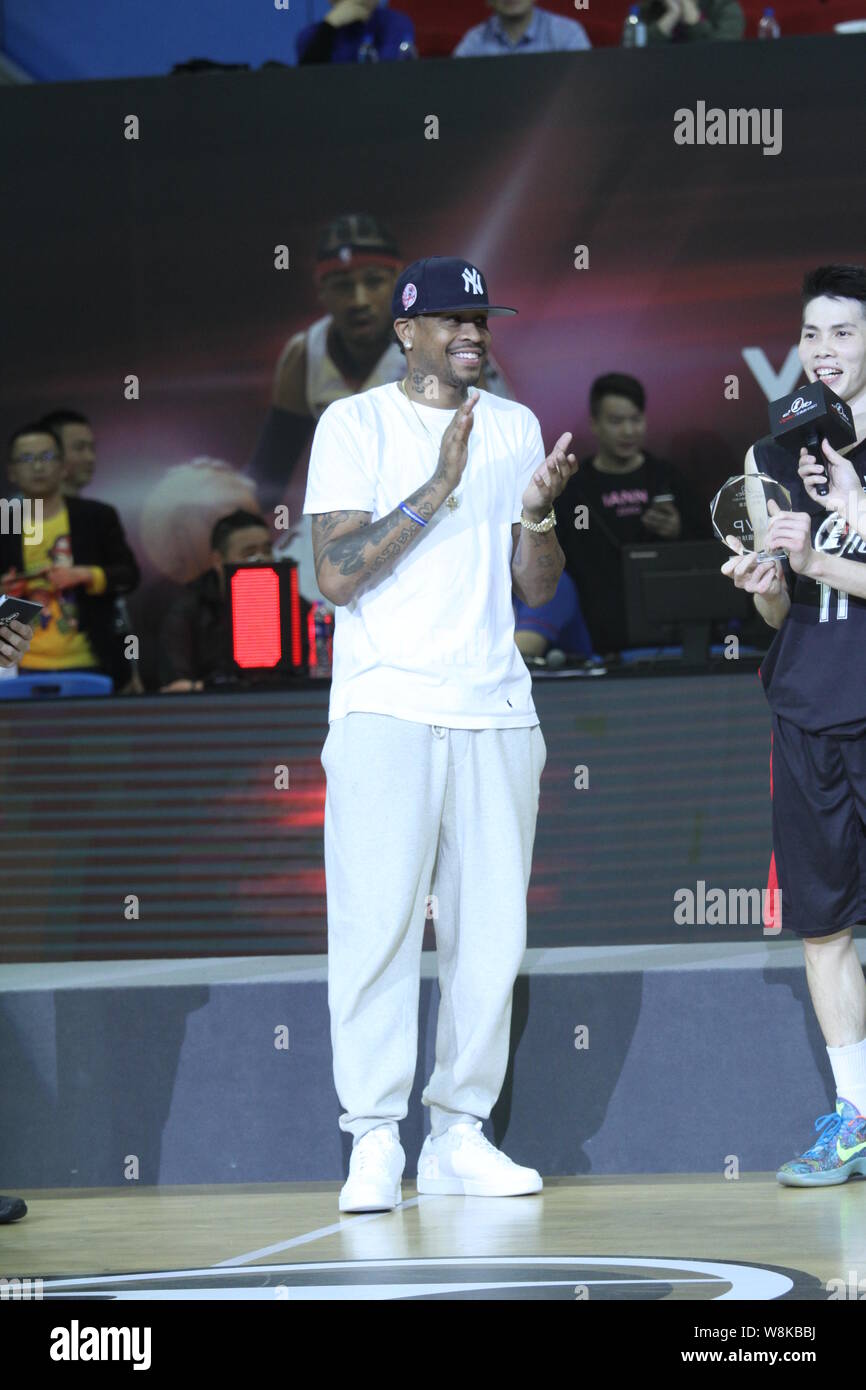 NBA star Allen Iverson, left, reacts in an all-star basketball match ...