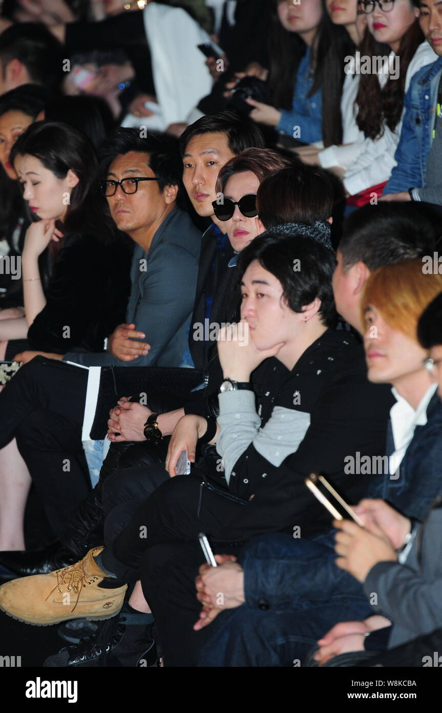 South Korean singer and actor Kim Jun-su, center, attends the fashion ...
