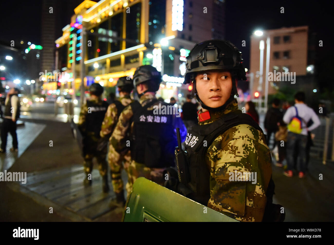 --FILE--Armed Chinese paramilitary policemen patrol a street in ...
