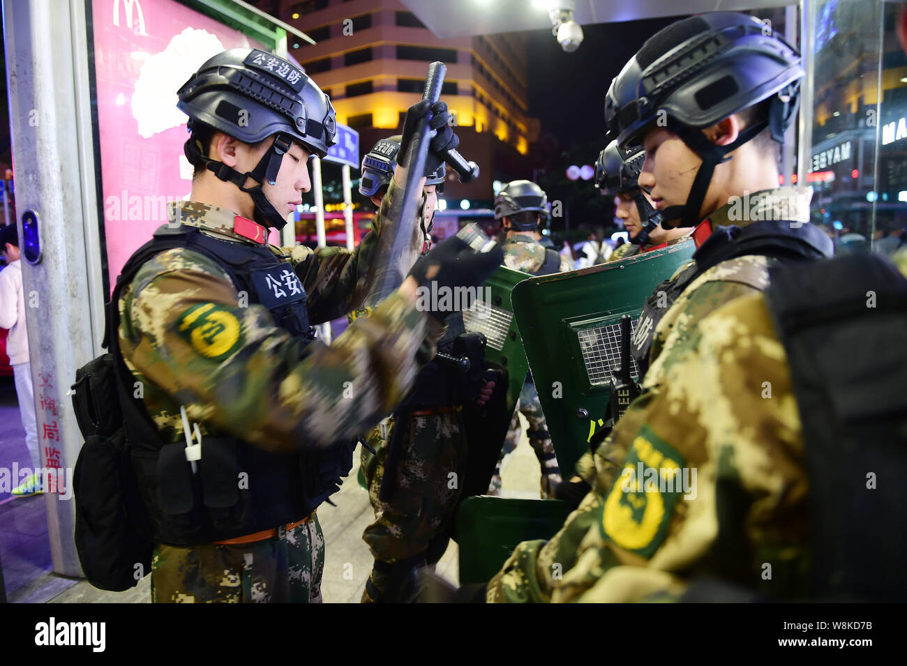 --FILE--Armed Chinese paramilitary policemen patrol a street in ...