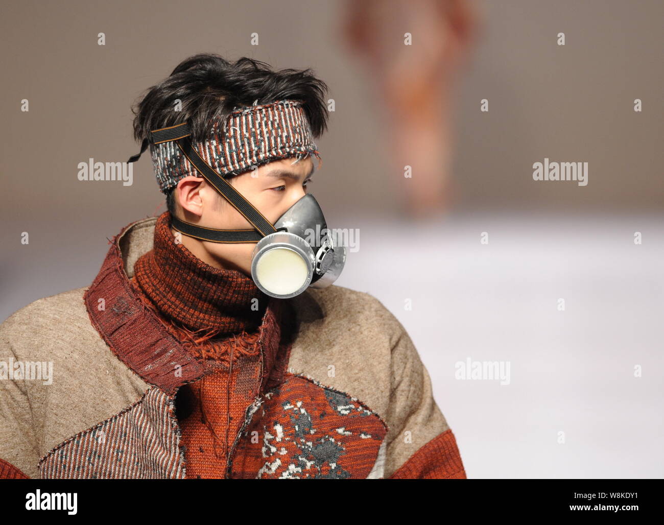 A model displays a new creation from the Beijing Institute of Fashion ...